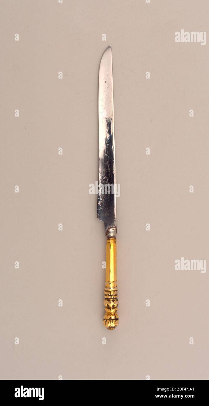 Knife. Blade has straight upper edge, the lower edge curving towards ...