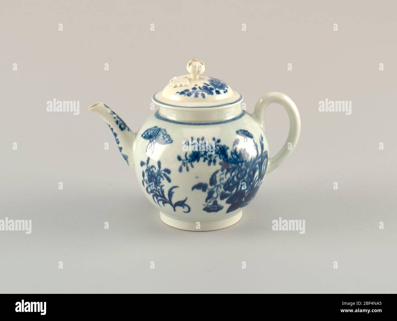 Teapot with Three Flowers Pattern. Globous on cylindrical foot, with ...