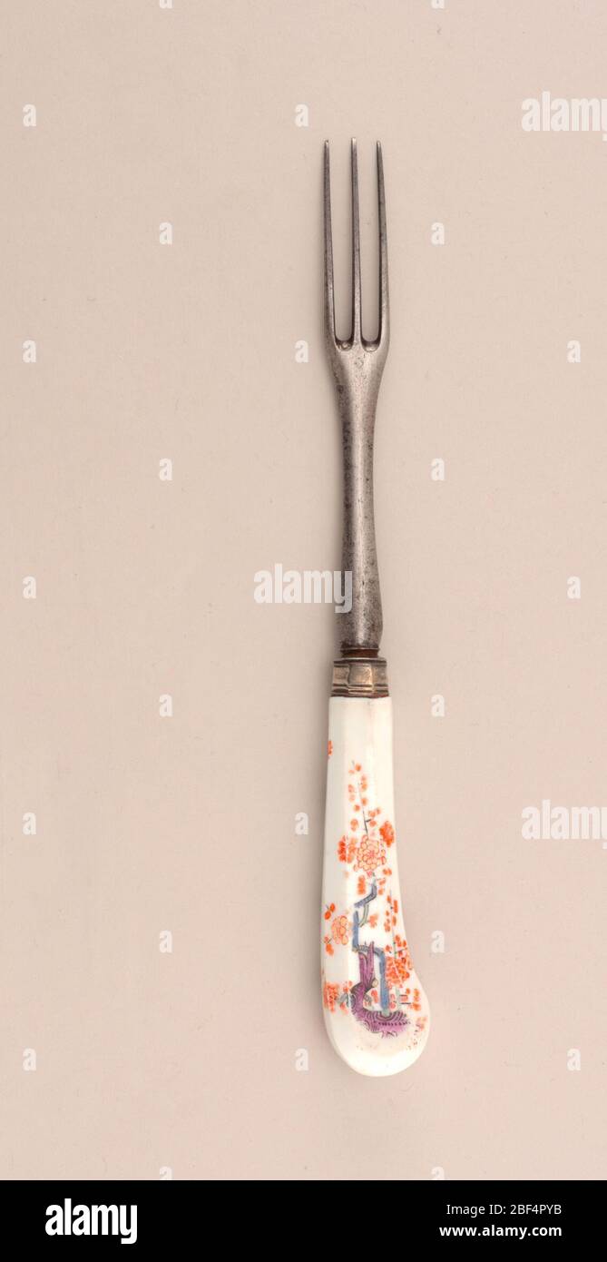 Fork with Porcelain Handle. Fork has three tines, slightly curved. Long ...