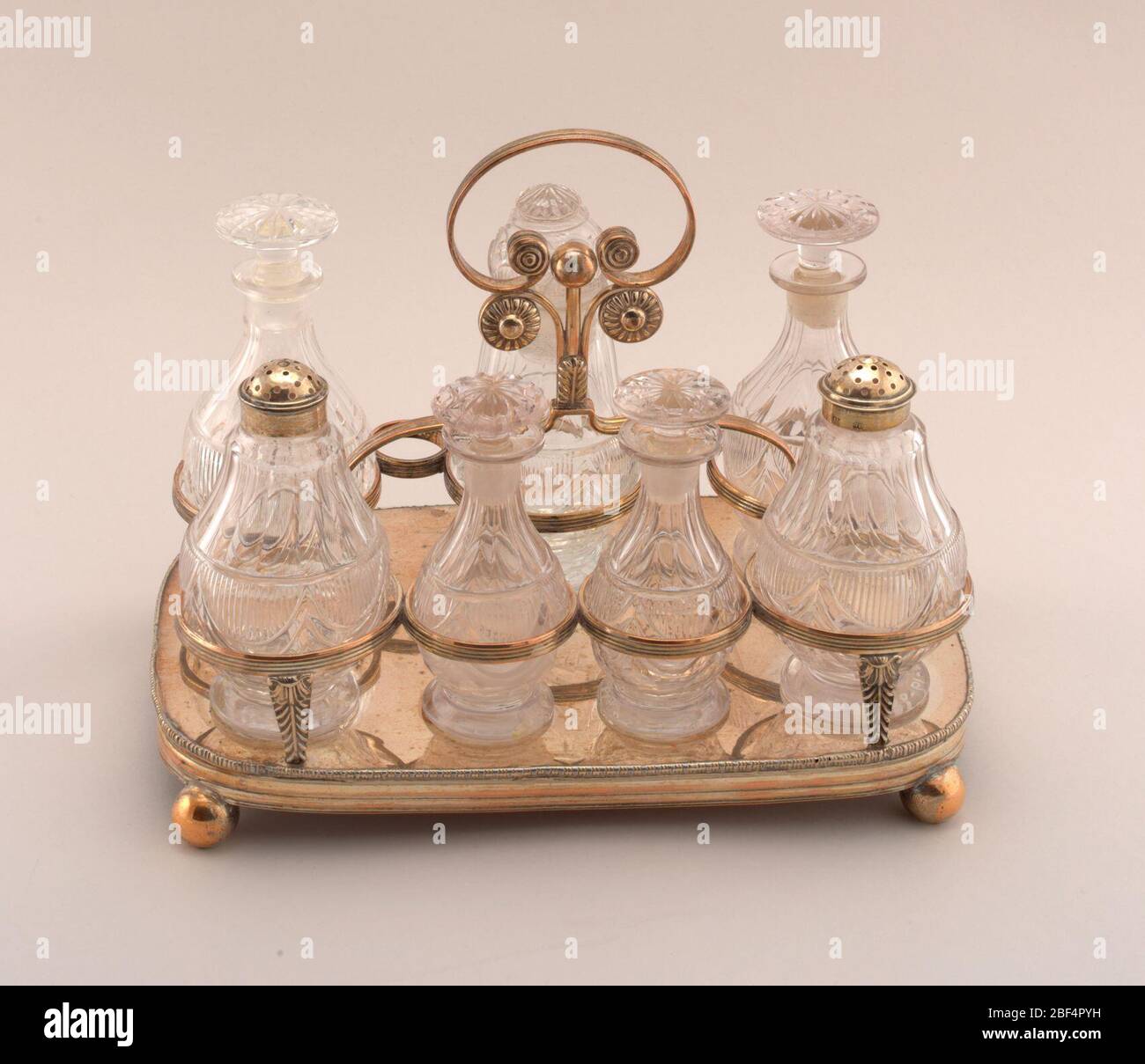 stand for bottles. Flat base with reeded molding around edge; thick ...