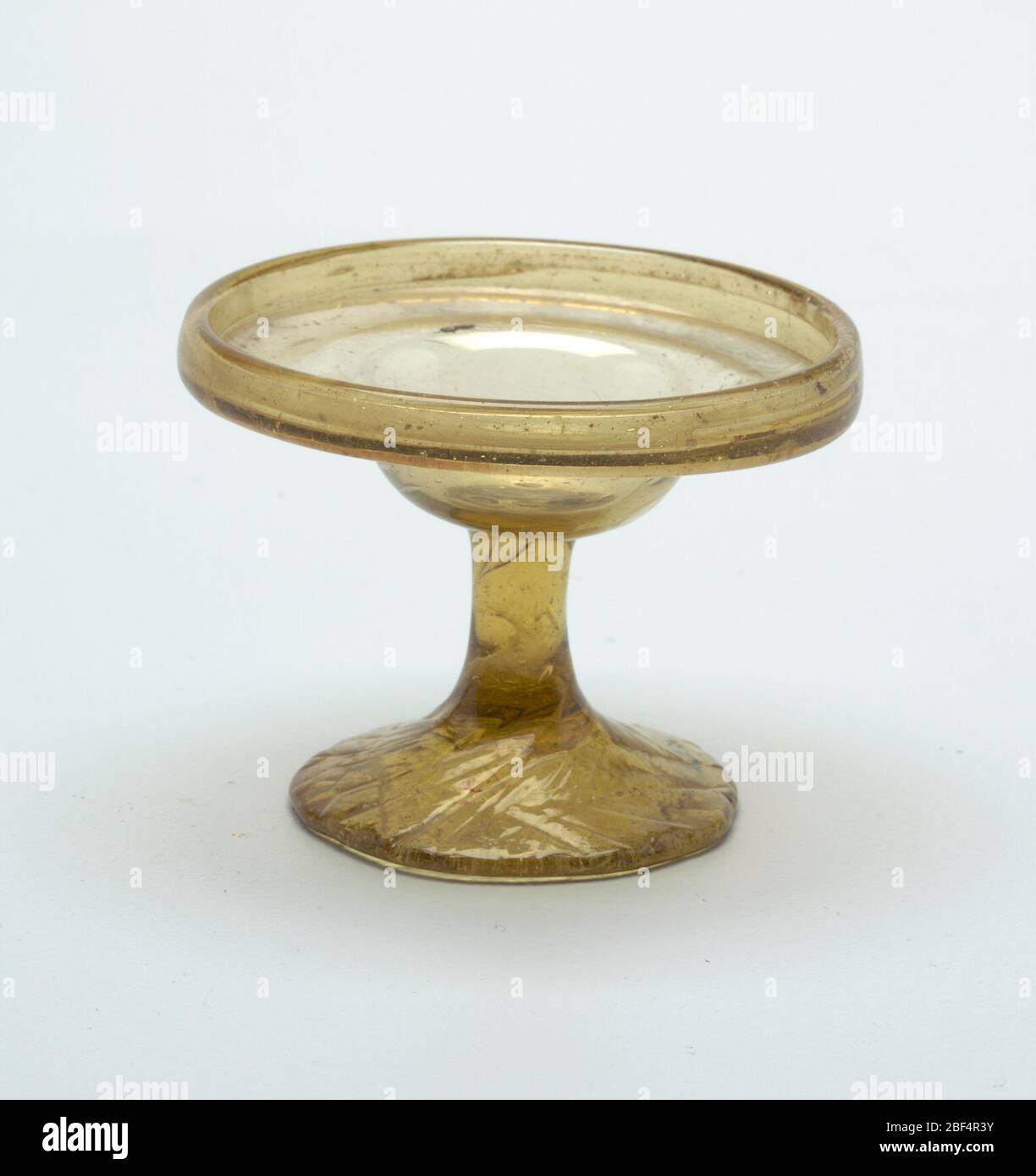 Cup. Inverted bell shape, shallow, with upright lip. On high stem and ...