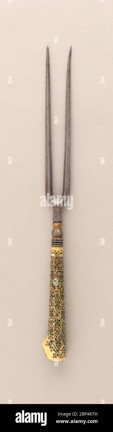 Fork. Fork has two long pointed tines, rounded shoulders. Baluster ...