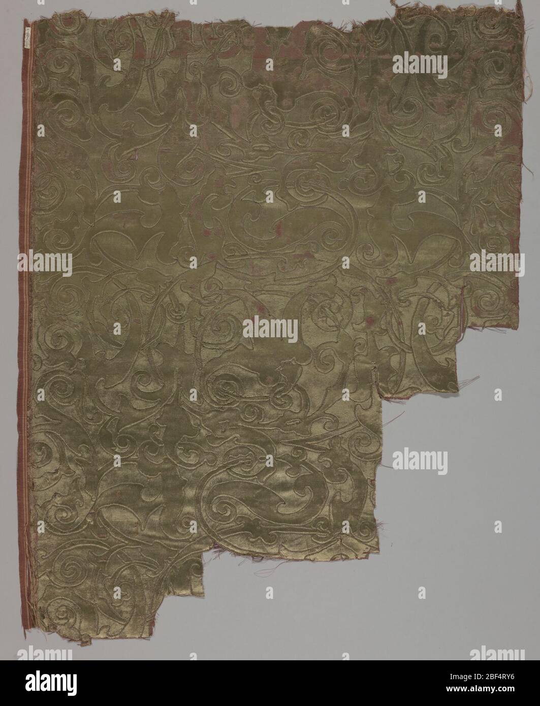 Textile. Brick red cloth ground completely covered by two heights of ...