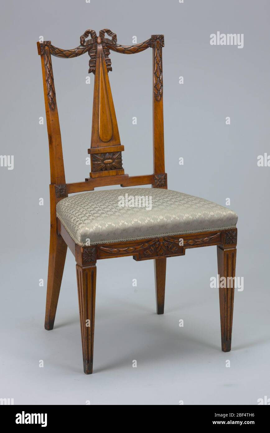 Chair. Rectangular open back; top rail composed of two swags centering ...