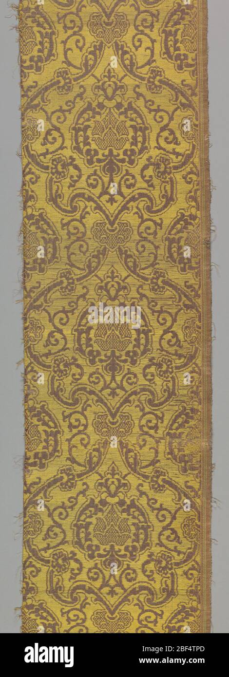 Textile. Scroll and pomegranate pattern in yellow and mauve Stock Photo ...