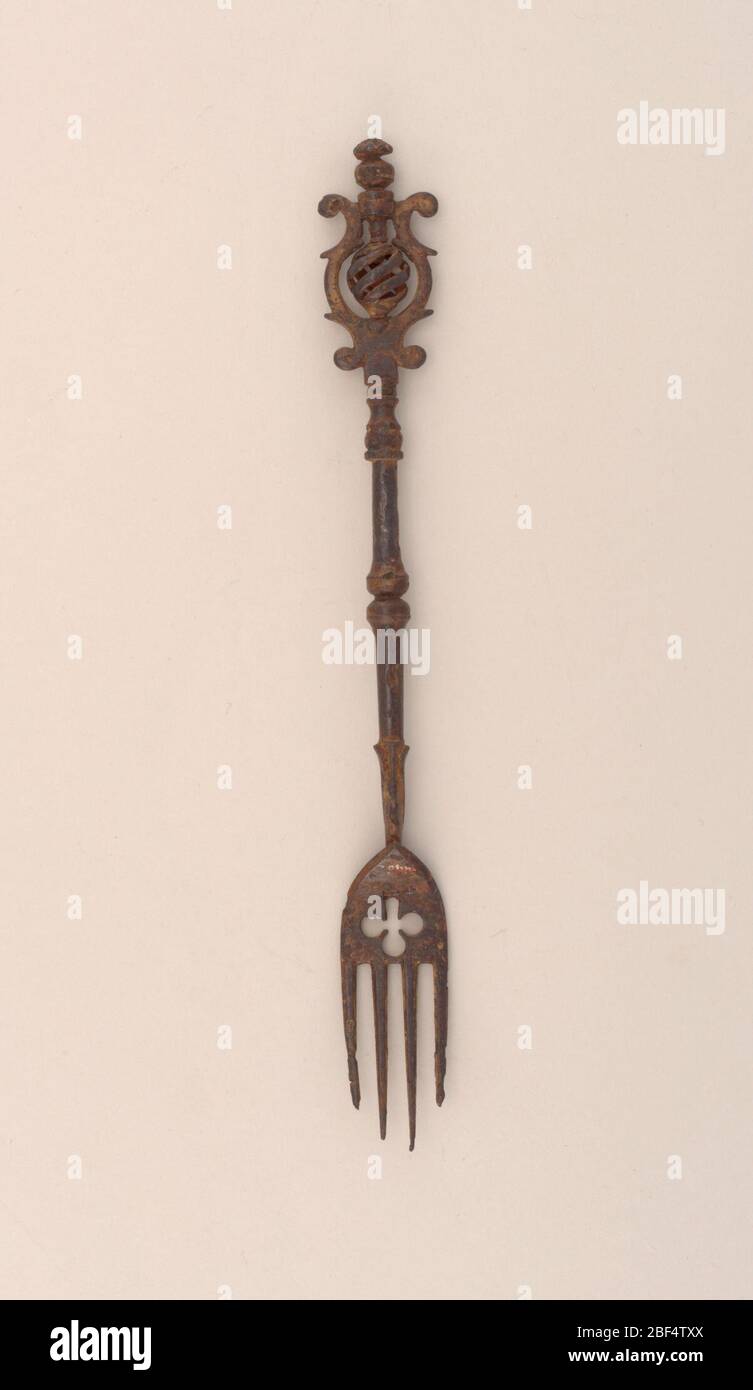 Fork. Four-tined fork, sloping shoulders. Neck pierced with trefoil ...