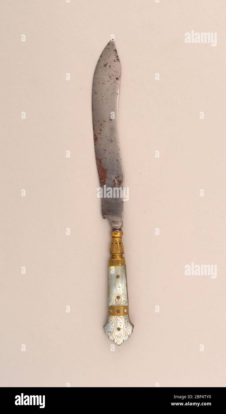 Knife. Sabre-shaped blade with a profiled upper edge, rounded bolster ...