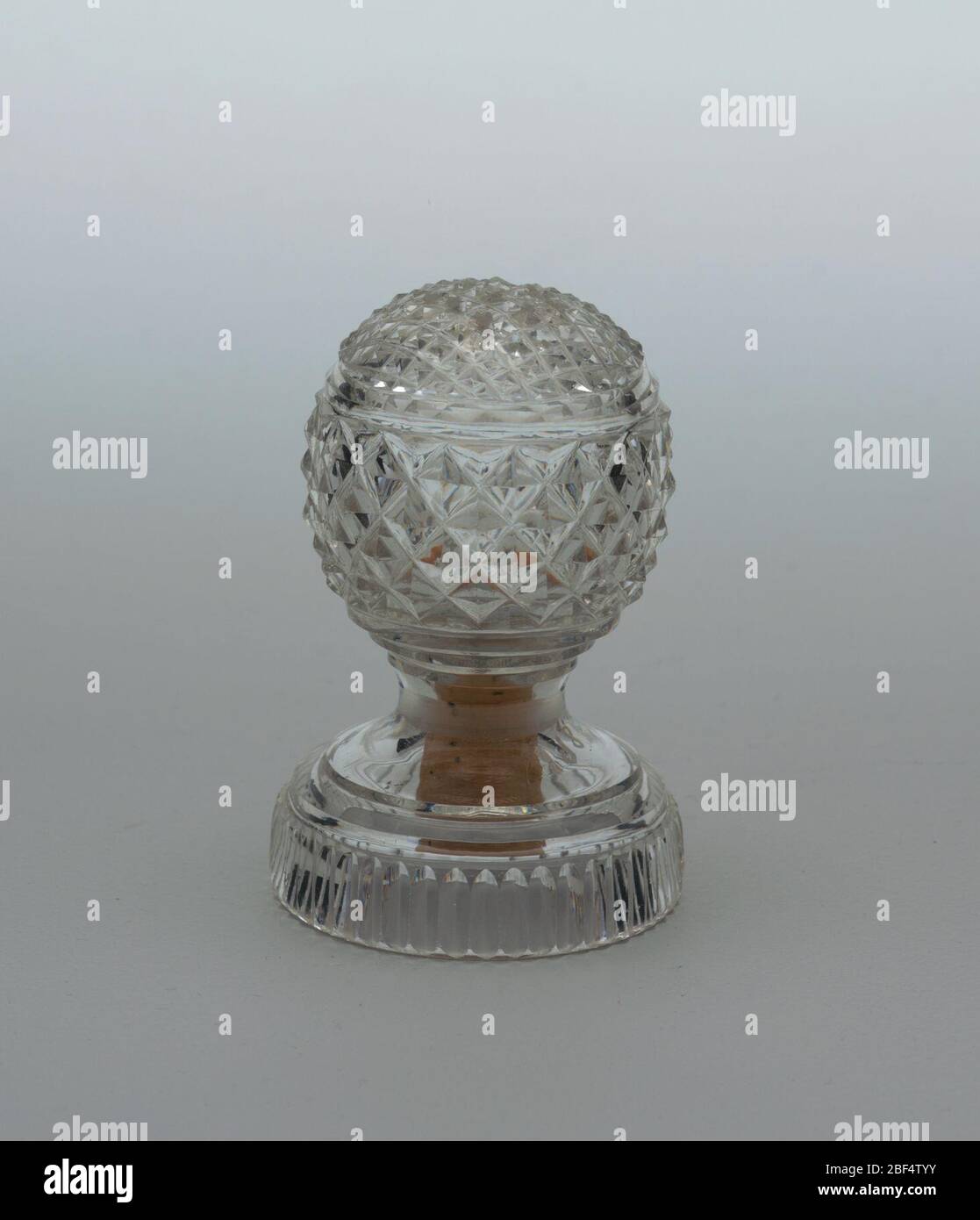 caster. Globular body, on stemmed circular foot. body decorated with ...