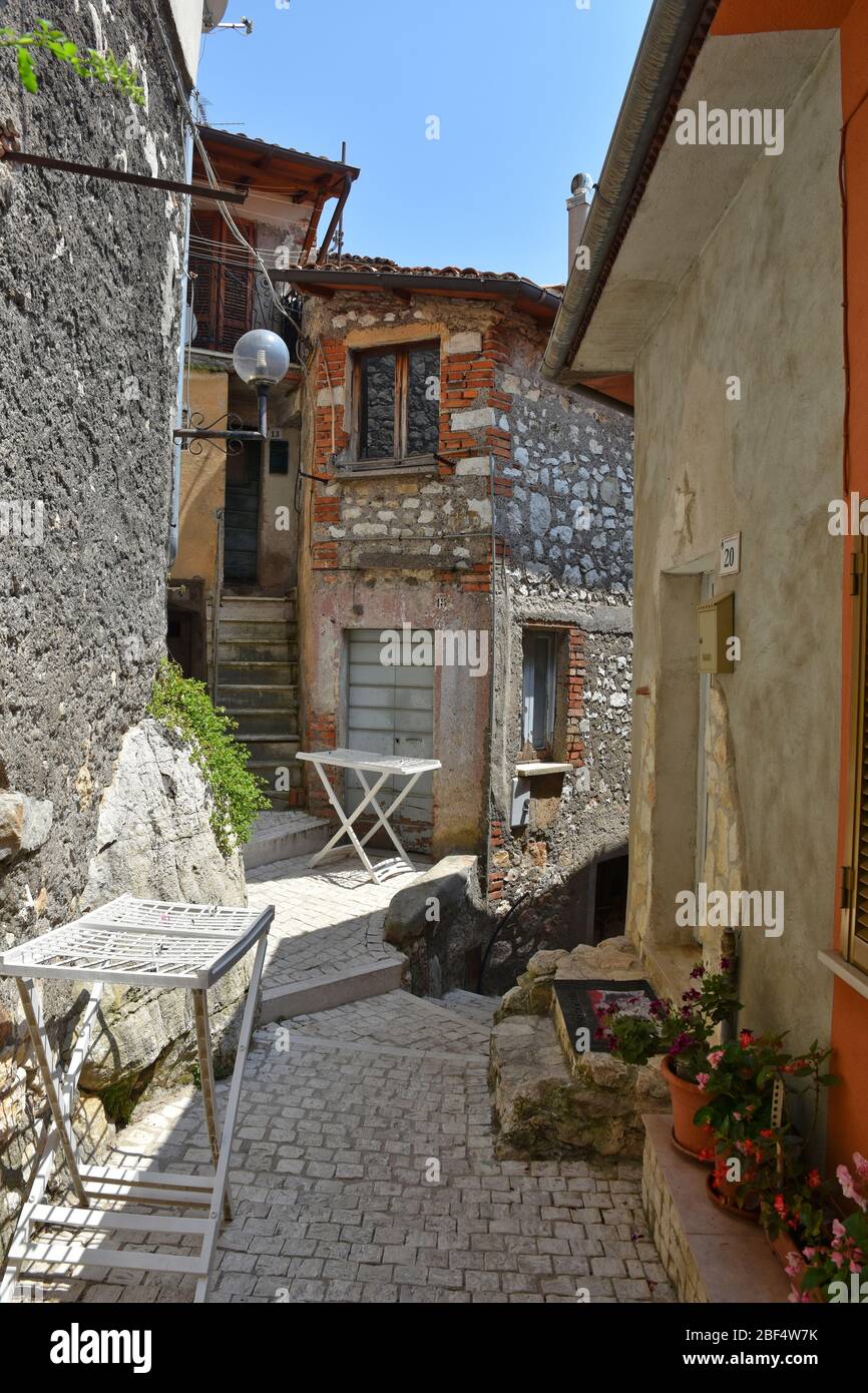 A narrow street between the old houses of Roccagorga, a rural village ...