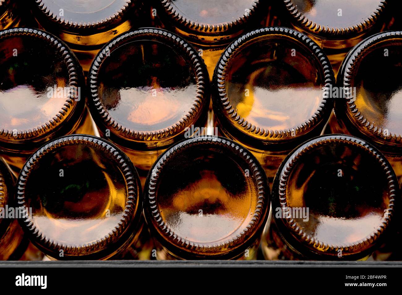 close up Bottoms of brown beer bottles group patterns texture on wall ...