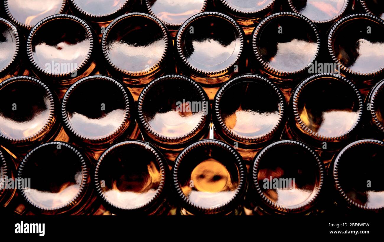 close up Bottoms of brown beer bottles group patterns texture on wall ...
