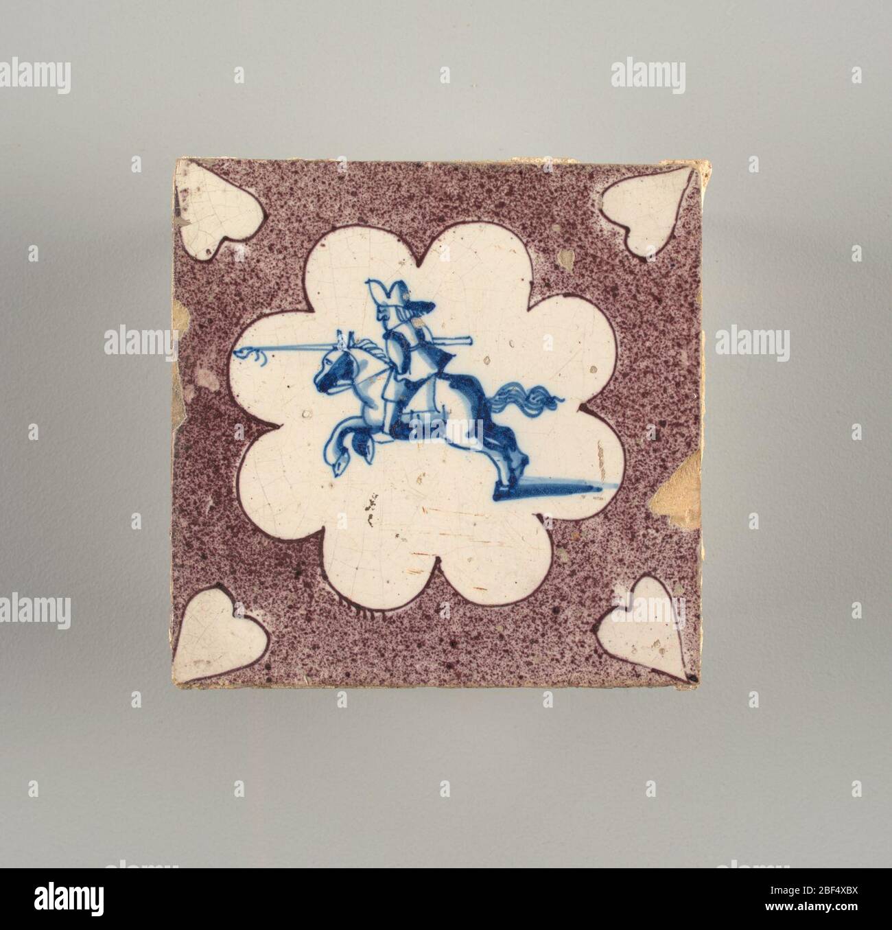 Tile. Square tile with cobalt blue figure of mounted lancer charging ...