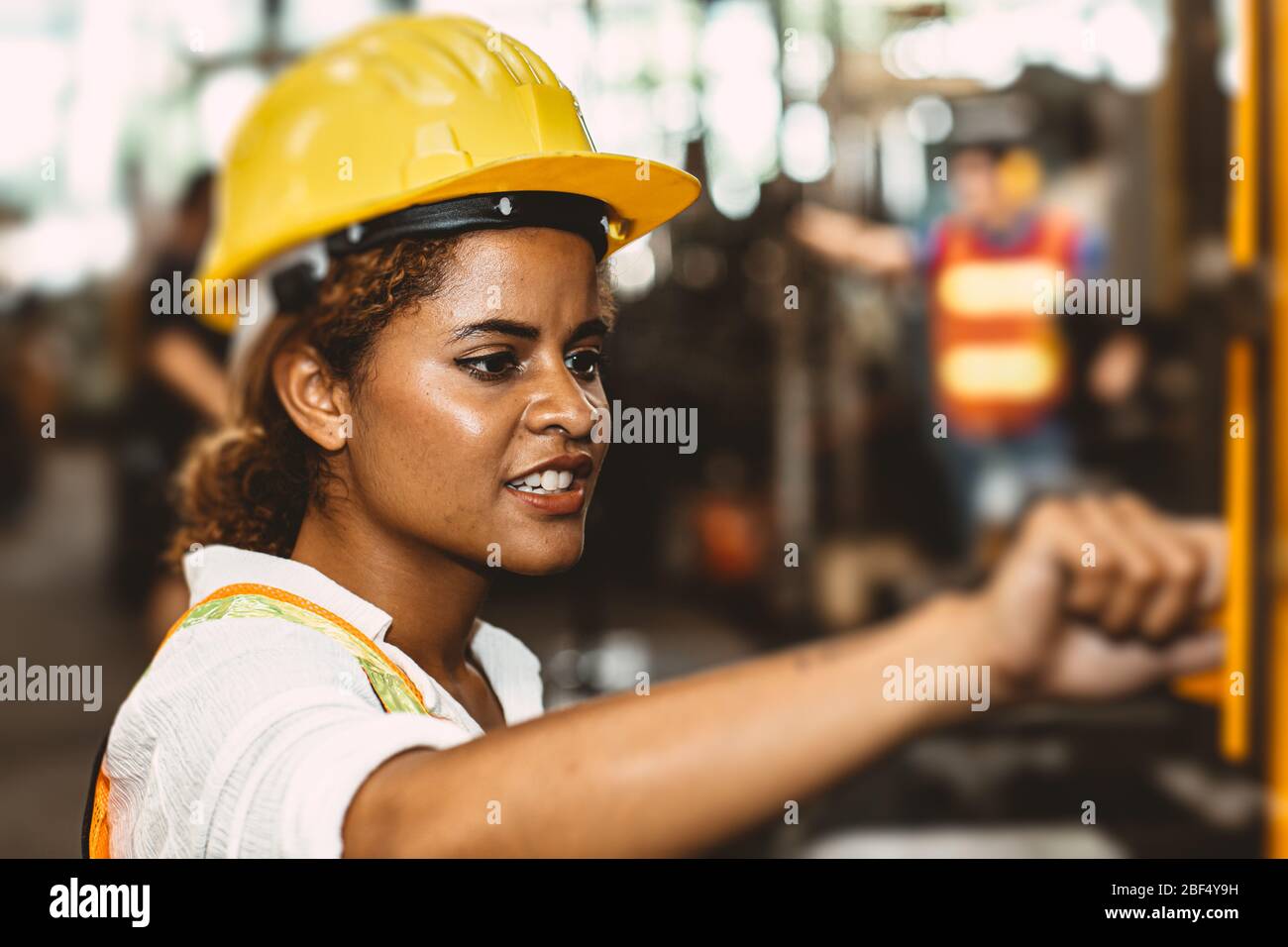 American black women teen worker working labor in industry factory with ...