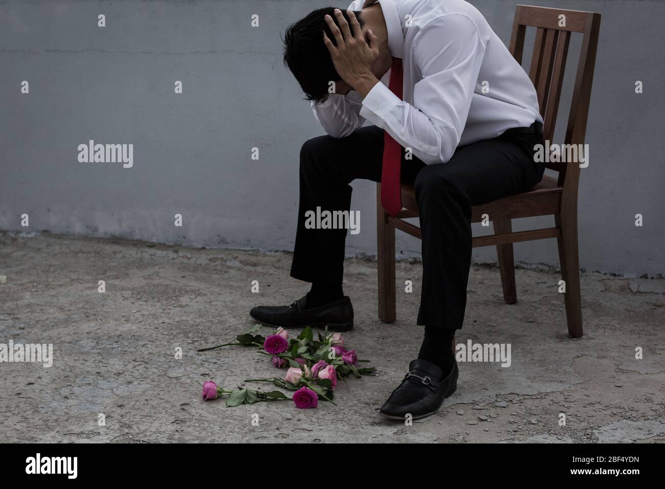 A disheartened man in a suit, broken-hearted after being rejected Stock ...