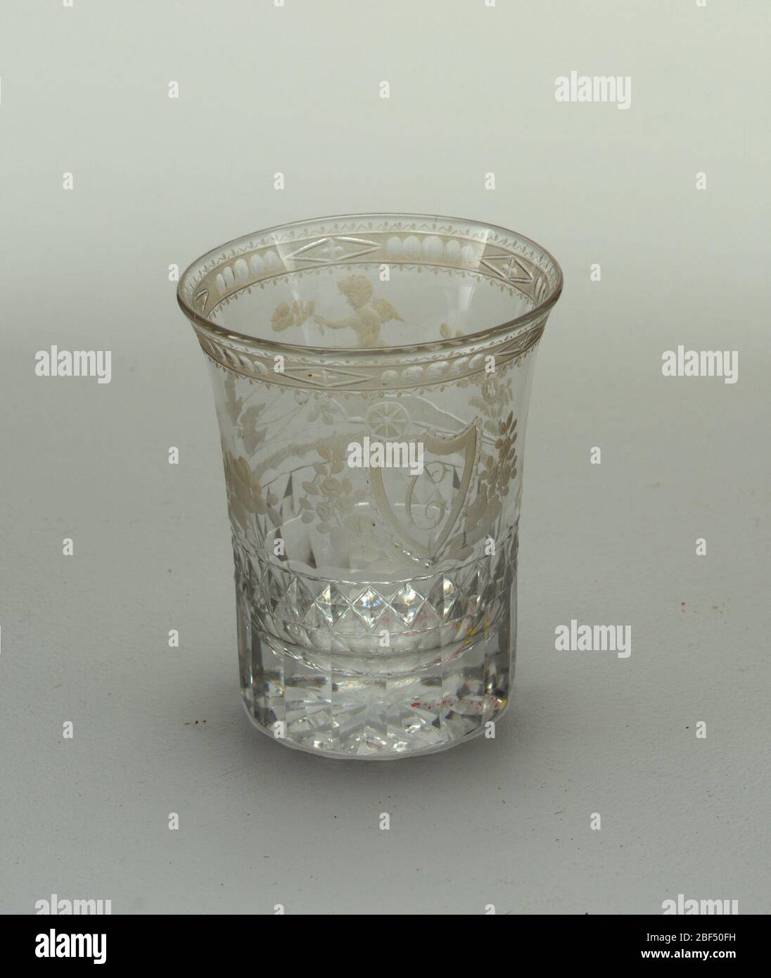 Beaker. Beaker with flaring rim. Heavy channeled base surmounted by a ...