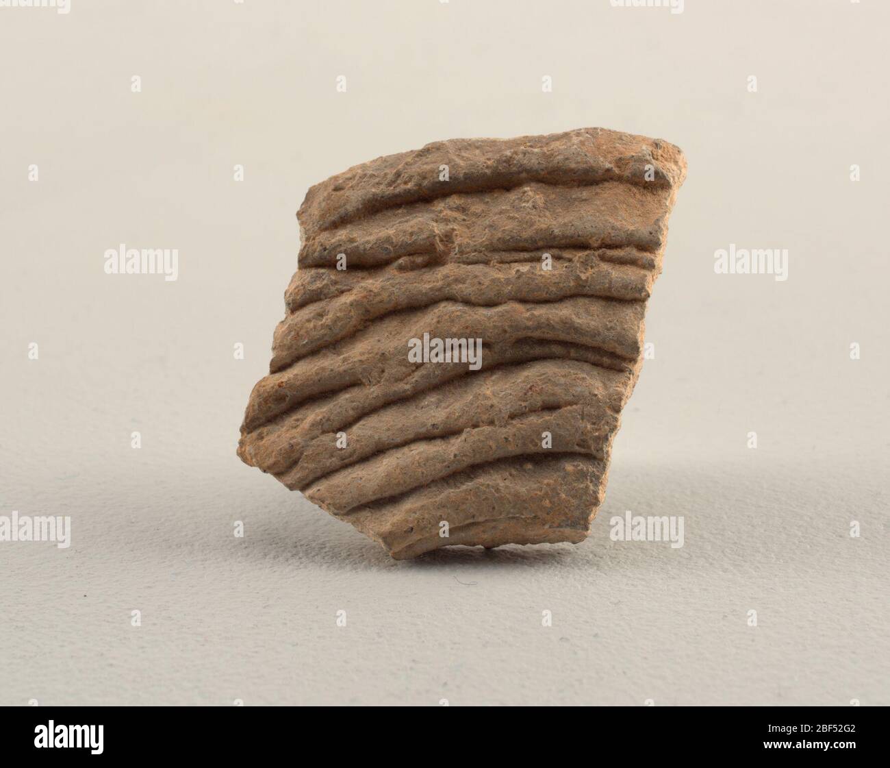 shard. Two pottery shardsa) Irregular fragment with roughly concentric ...