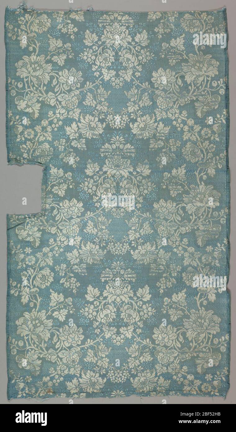 Textile. Light blue silk with white wefts bound in twill weave showing ...