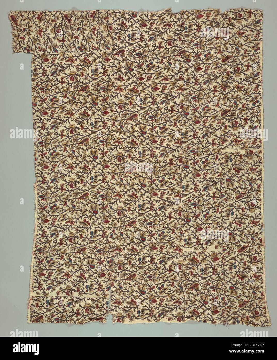 Textile. Closely-set pattern of a thorn bush with leaves and berries ...