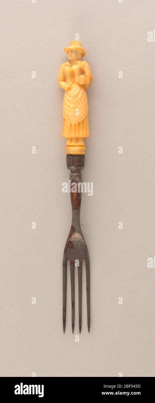 Fork. Four tines, slightly curved. Sloping shoulders, baluster-shaped ...