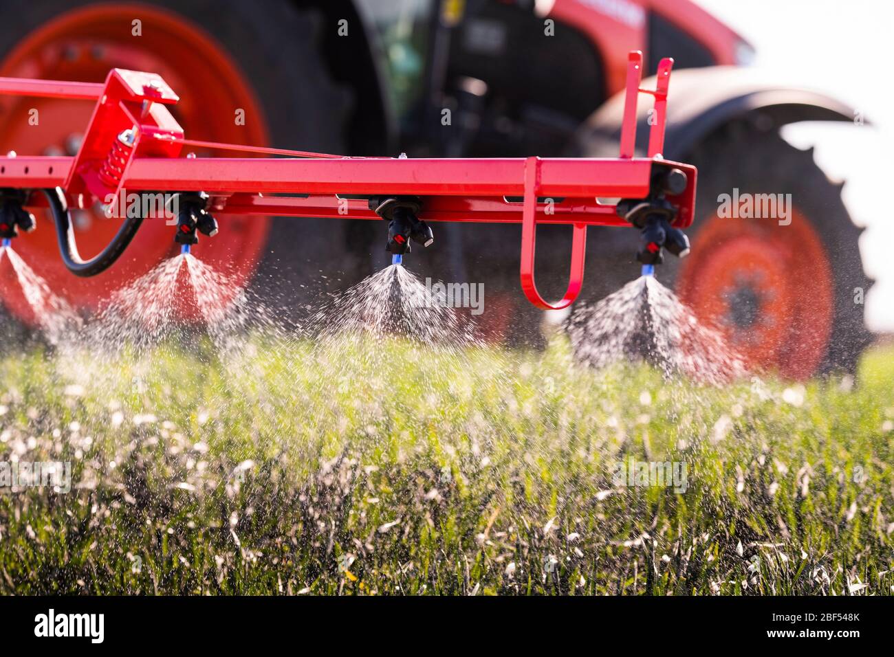 Nozzle of the tractor sprinklers sprayed Stock Photo - Alamy