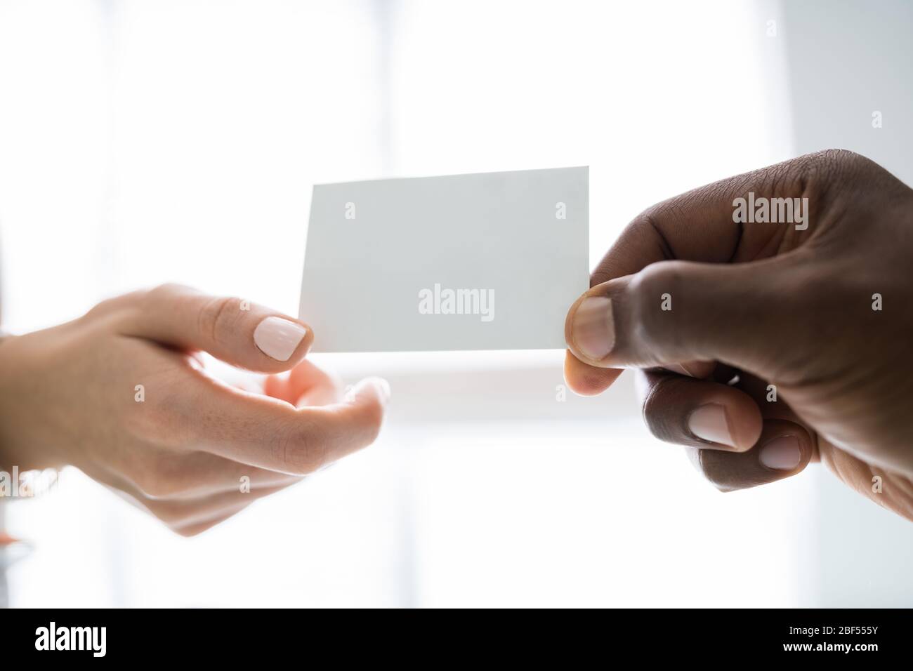 Handing over business card hi-res stock photography and images - Alamy