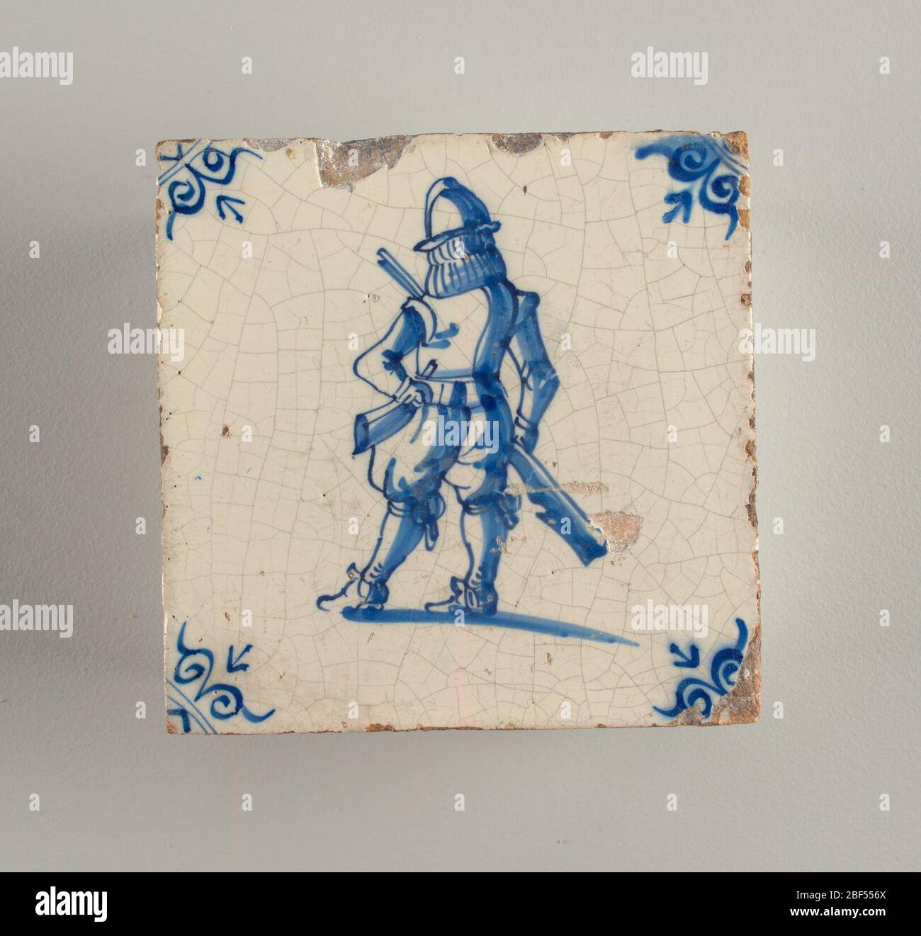 Tile. Square tile, blue on white. Soldier with helmet and breastplate ...