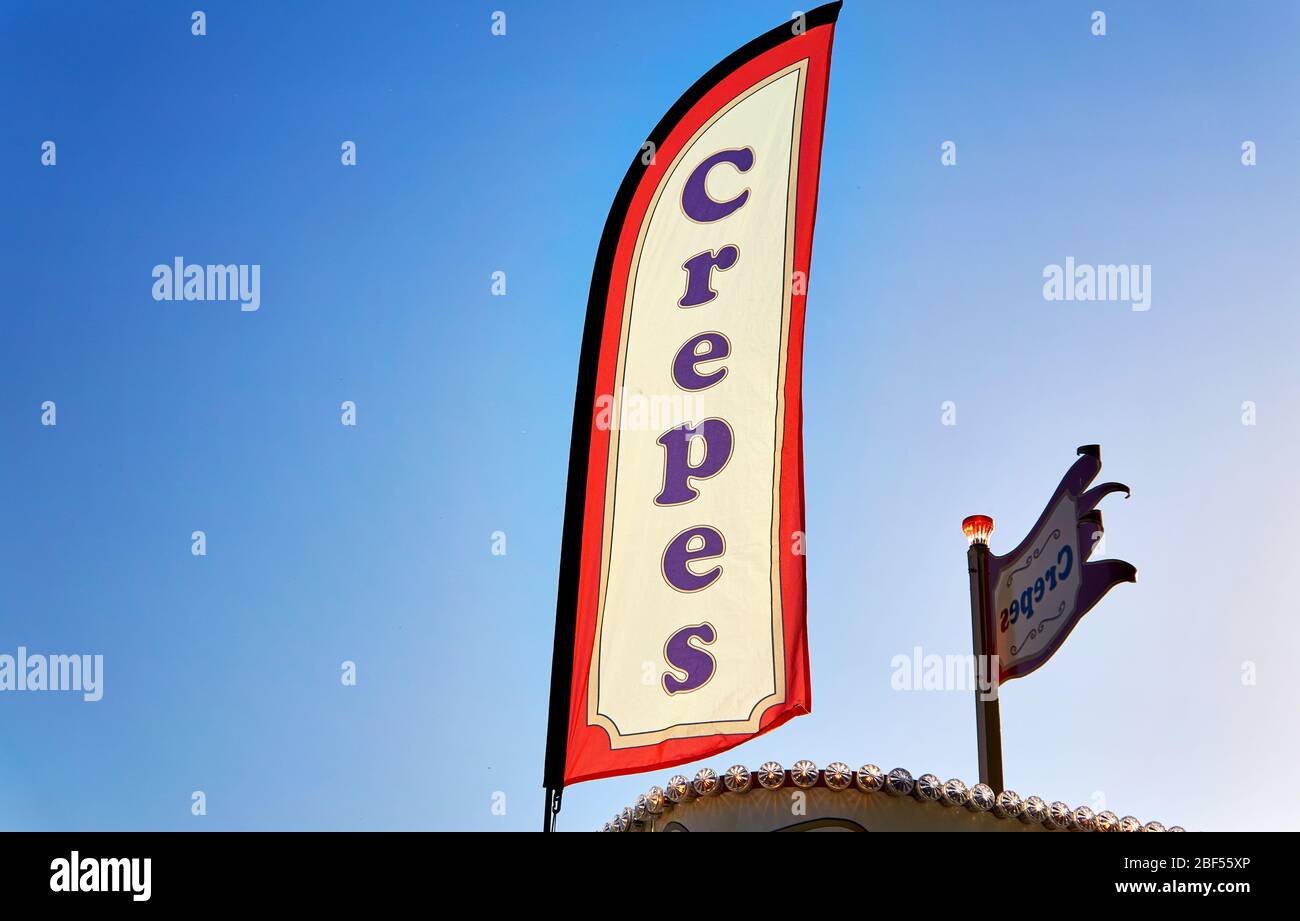 Crepes as text on a flag with blue background Stock Photo - Alamy
