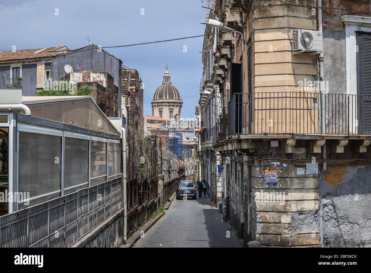 Narrow street in Catania, second largest city of Sicily island in Italy ...