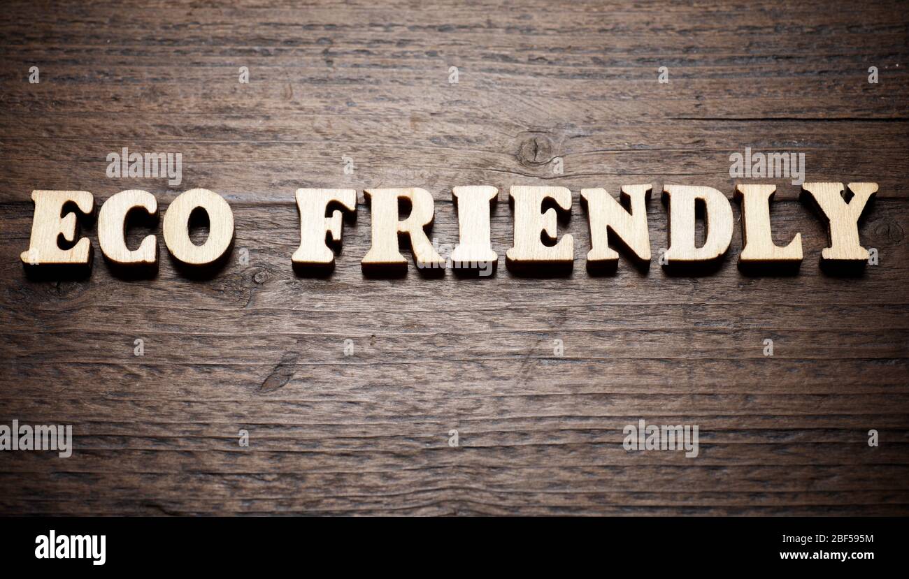 Eco friendly text on a wood table Stock Photo - Alamy