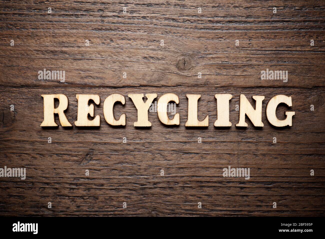 Recycling word on a wood table Stock Photo - Alamy