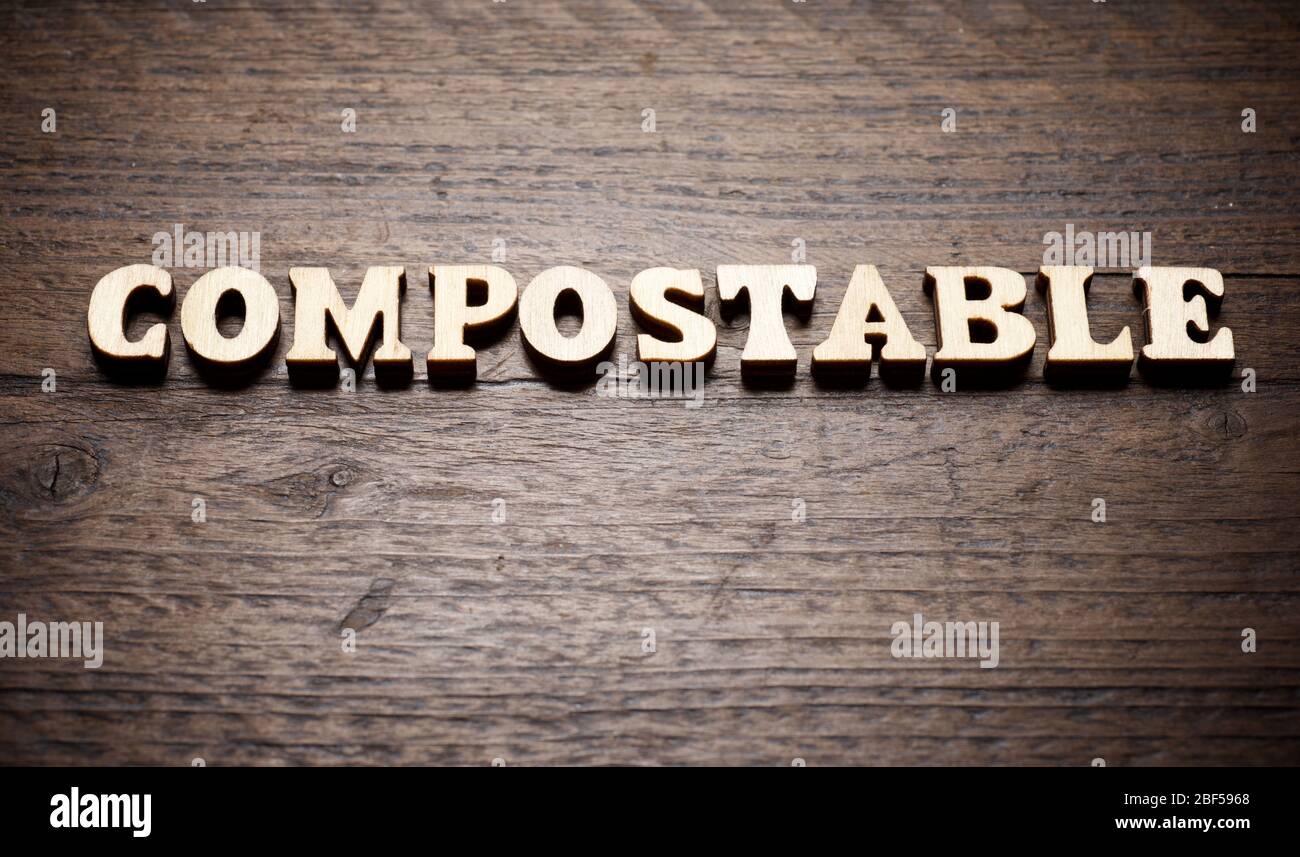 Compostable word on a wood table Stock Photo - Alamy