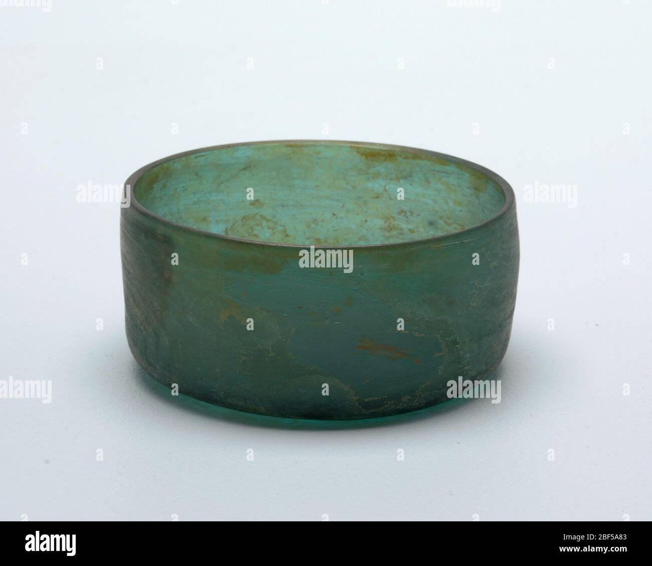 Bowl. Deep circular bowl with straight sides tapering slightly at the ...