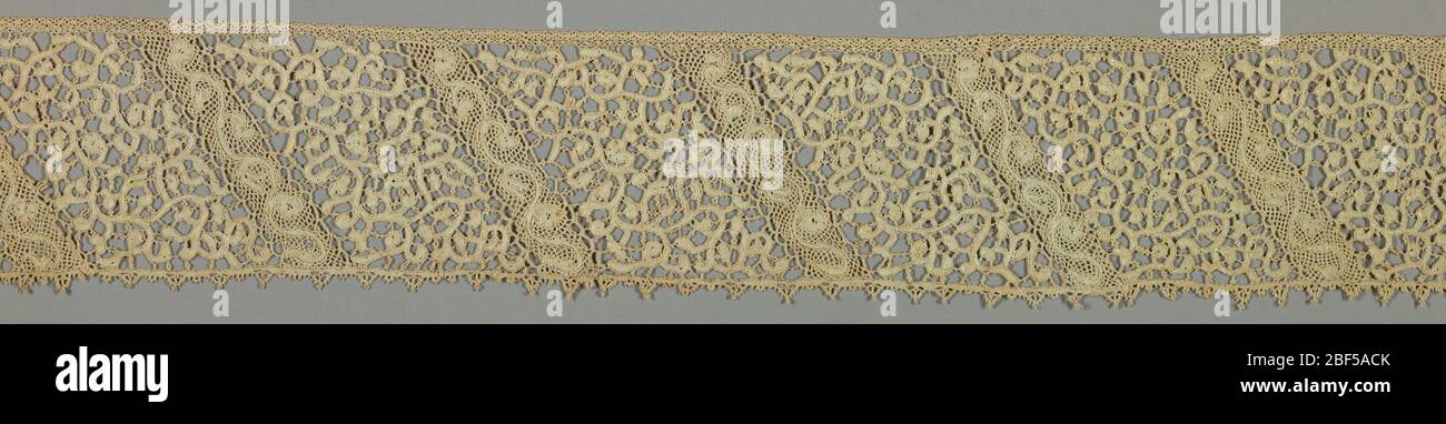 Band. A narrow band diagonally striped with a small floral serpentine ...