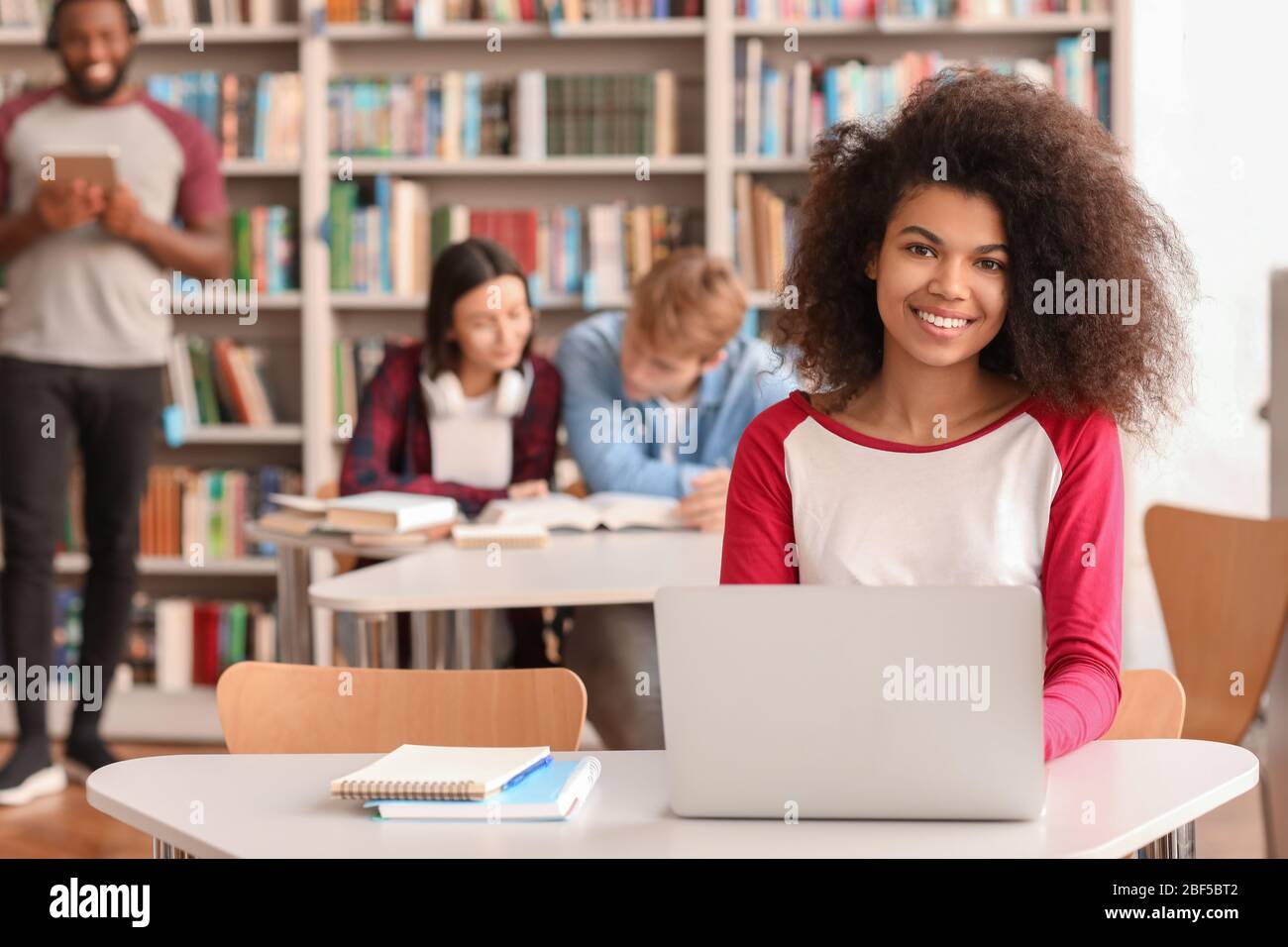African-American student preparing for exam in library Stock Photo - Alamy
