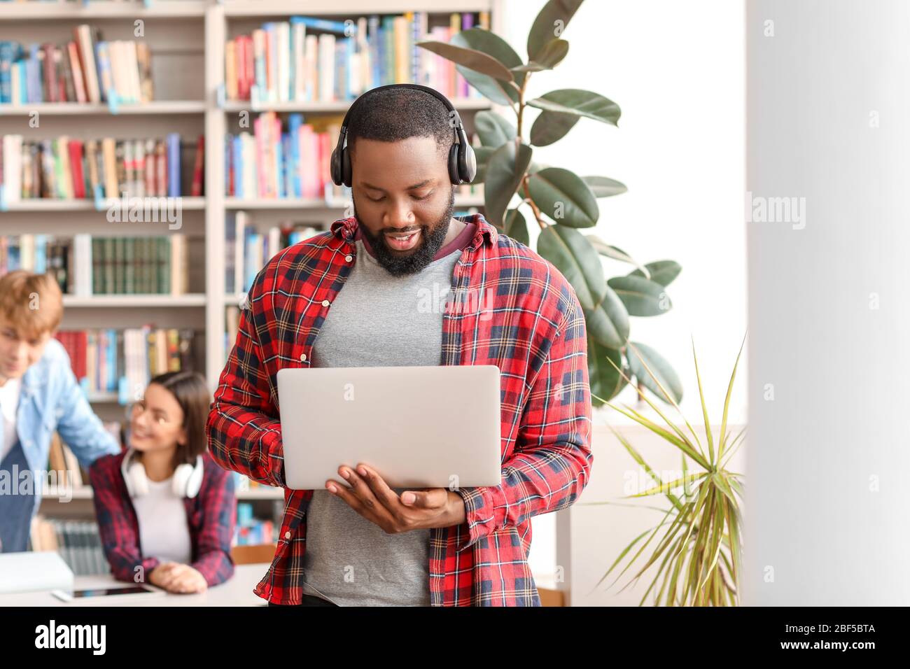 African-American student preparing for exam in library Stock Photo - Alamy
