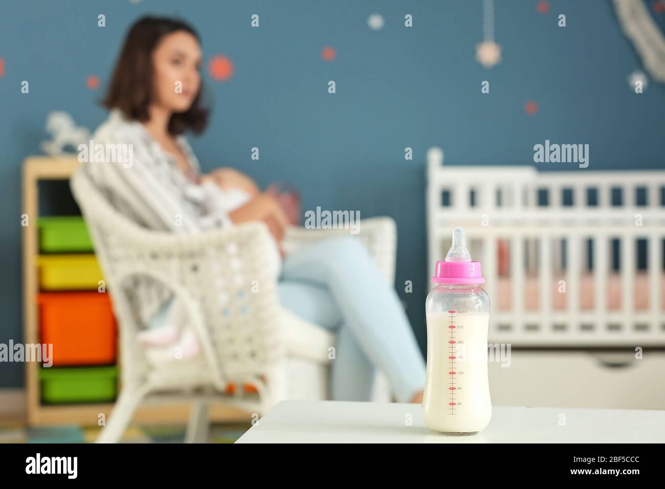 Bottle of milk on table in room Stock Photo - Alamy