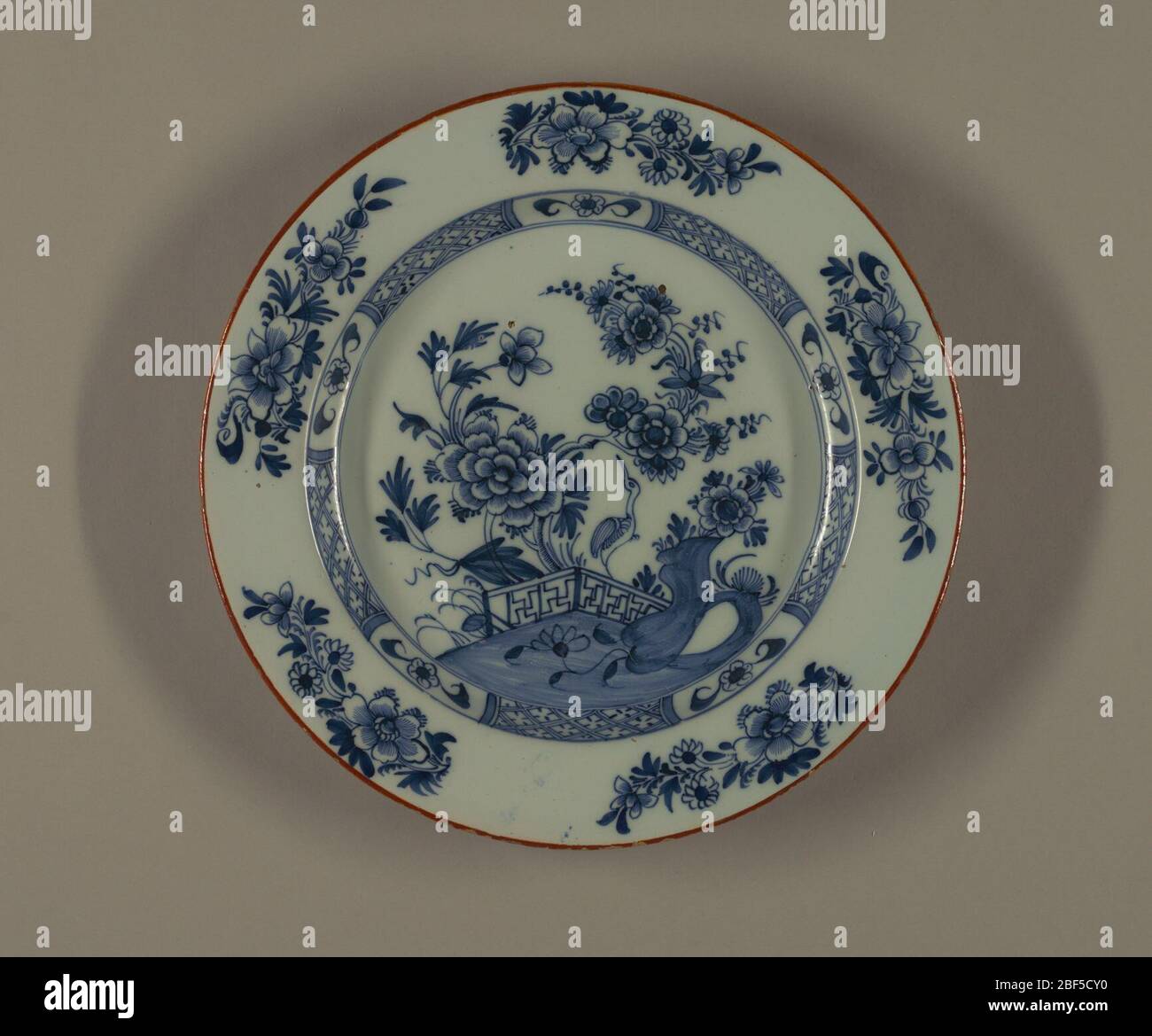 Plate. Circular plate with wide rim; painted in underglaze blue on ...
