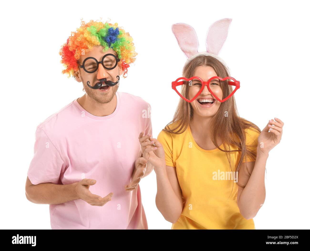 People in funny disguise on white background. April fools' day ...
