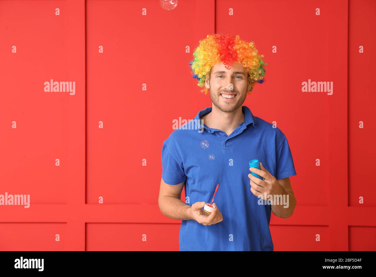 Man in funny disguise on color background. April fools' day celebration ...