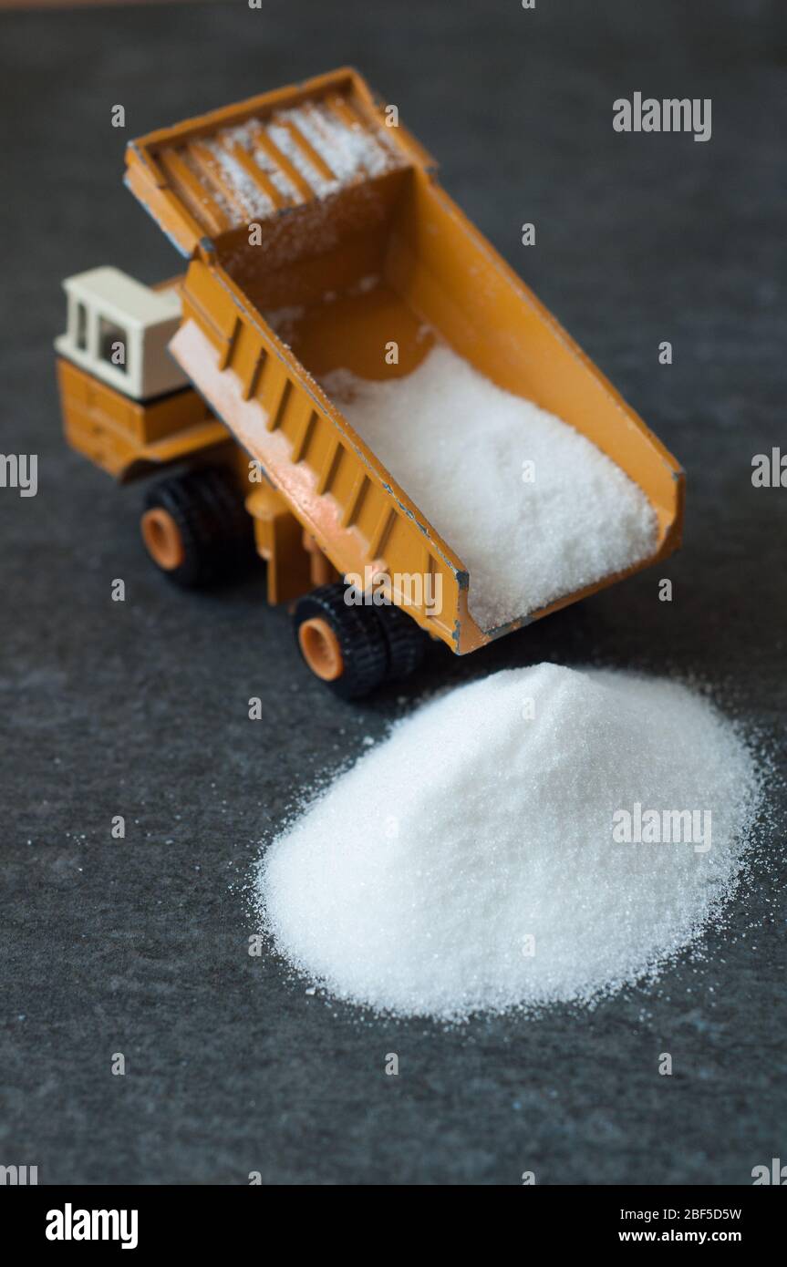 model of big mining dump-body truck with white sugar Stock Photo - Alamy