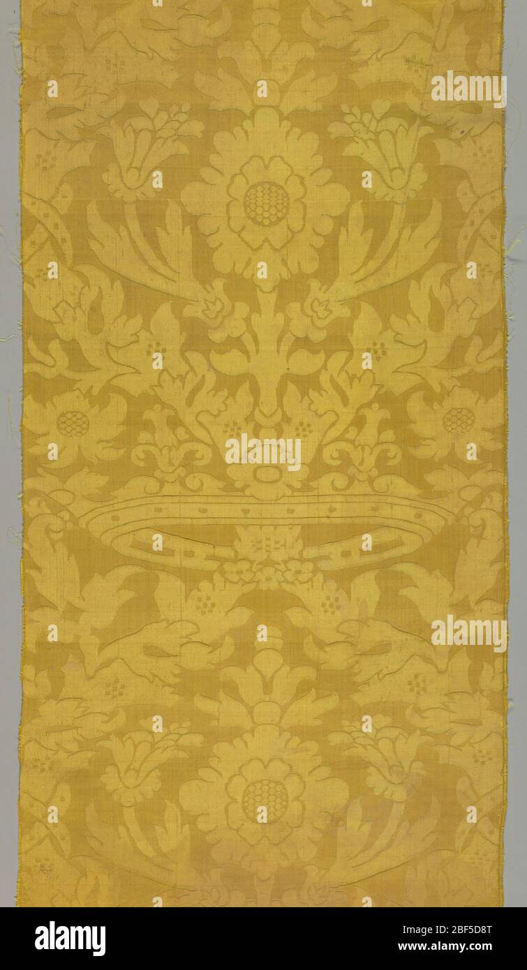 Fragment. Yellow damask with a large scale symmetrical design showing ...