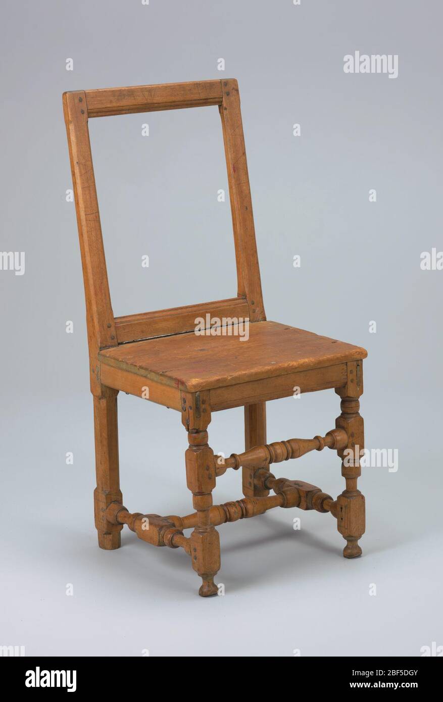 Chair. This side chair is comprised of turned stretchers, a flat seat ...