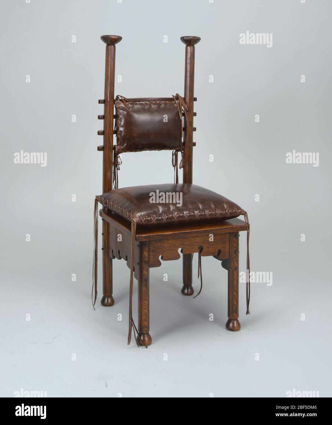side chair. High-backed side chair; oak frame composed of two posts ...