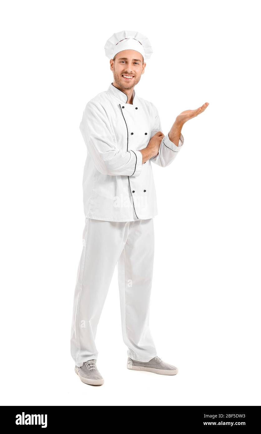 Handsome male chef showing something on white background Stock Photo ...