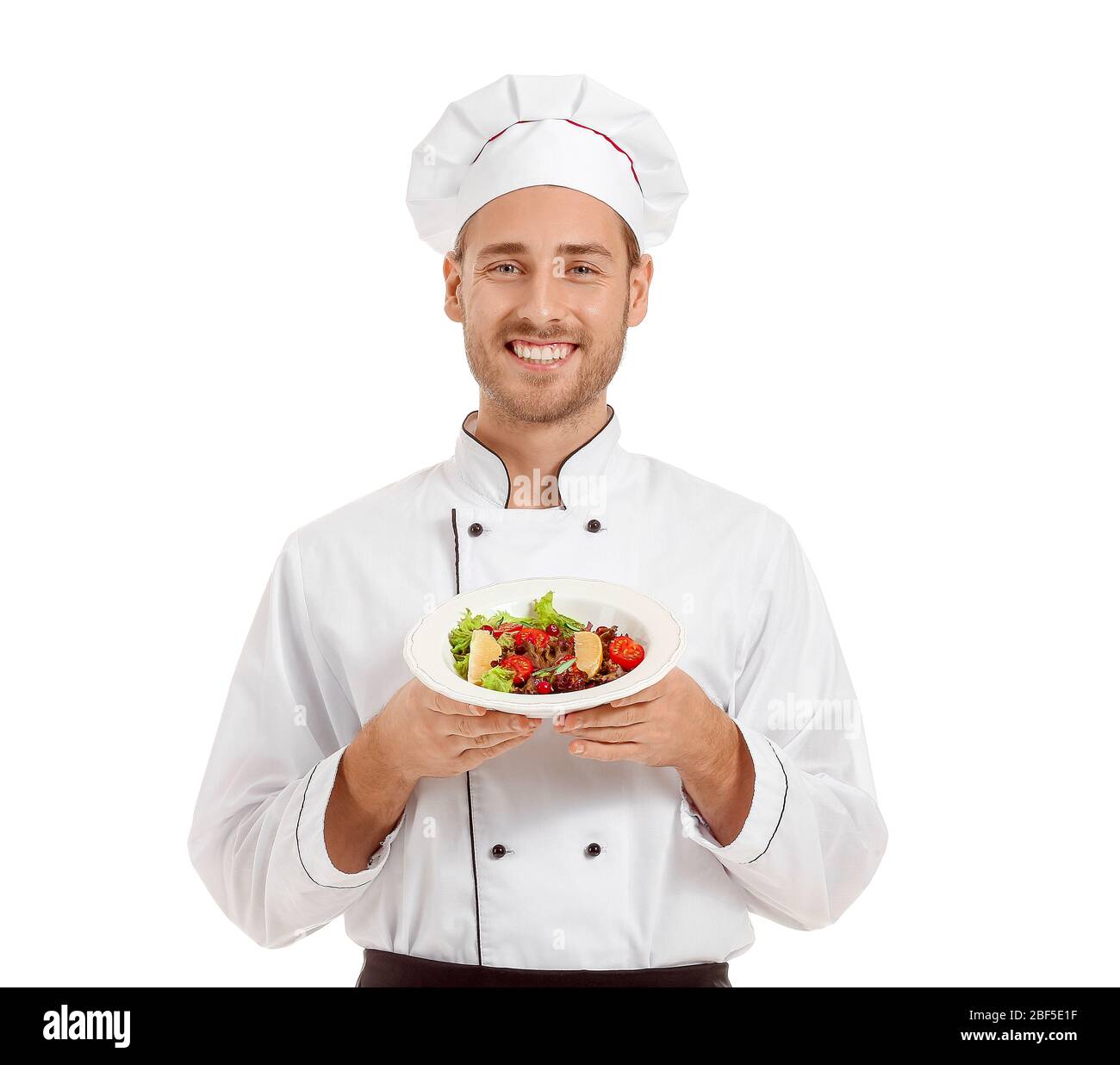 Happy male chef with prepared dish on white background Stock Photo - Alamy