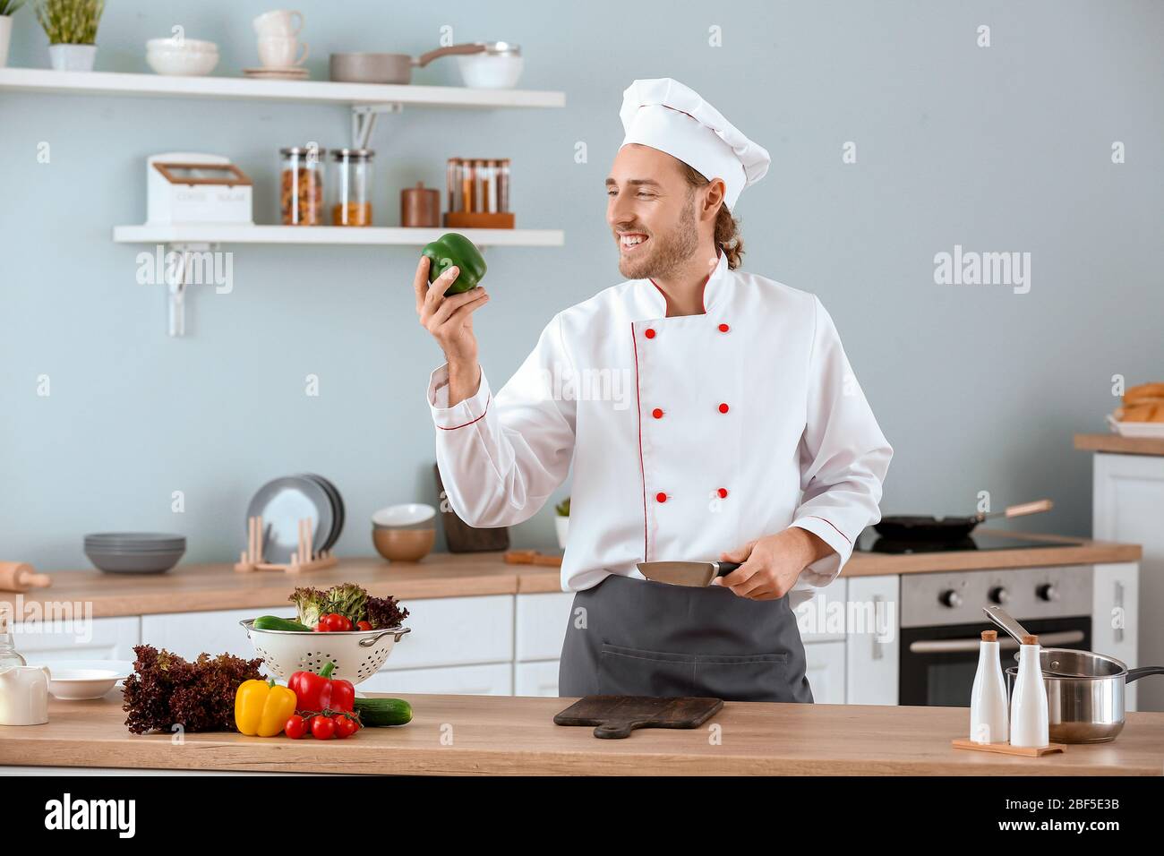Male chef cooking in kitchen Stock Photo - Alamy