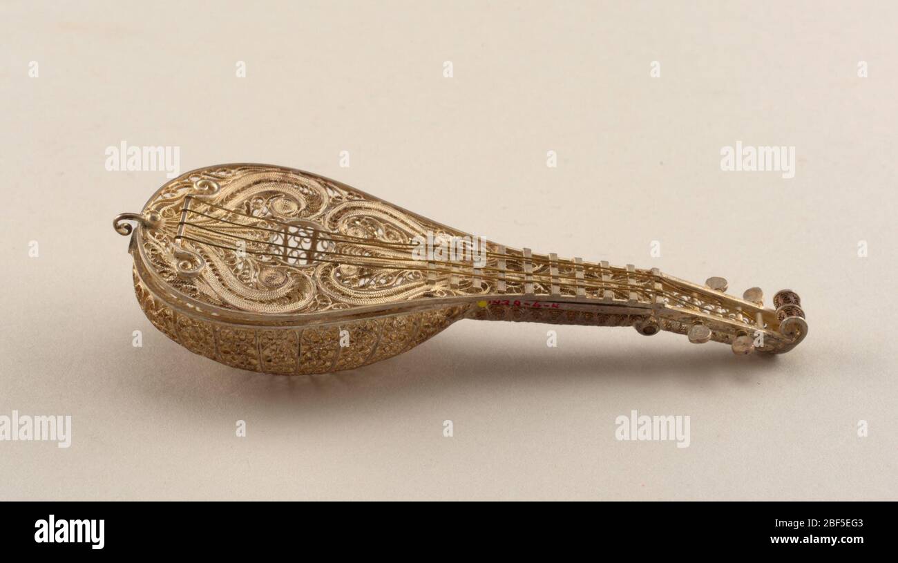 Mandolin. Top worked in plumose designs; equipped with four keys and ...