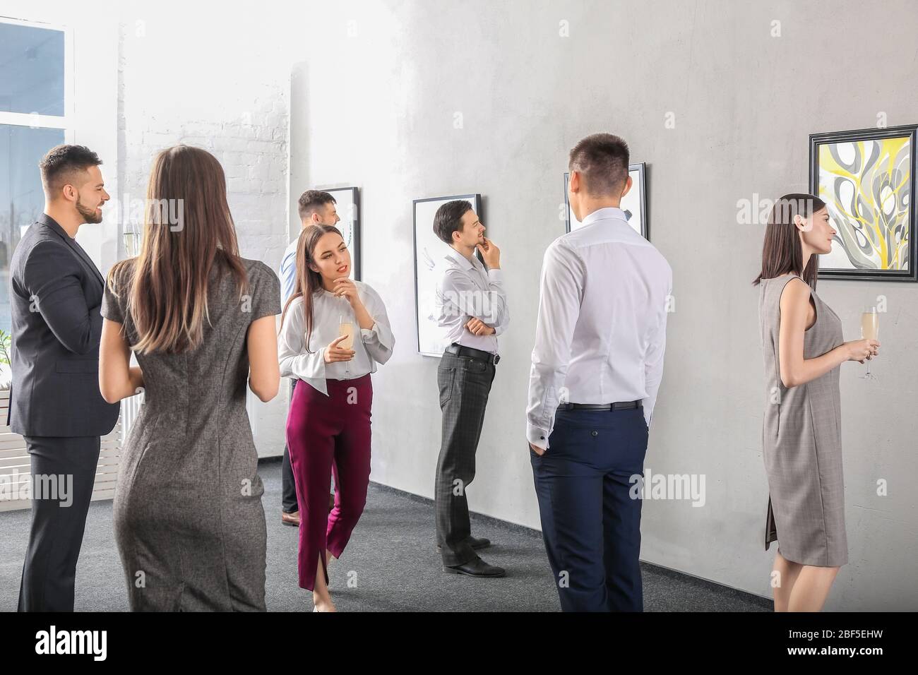 People at exhibition in modern art gallery Stock Photo - Alamy