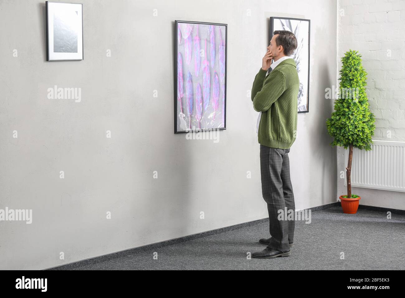 Man at exhibition in modern art gallery Stock Photo - Alamy
