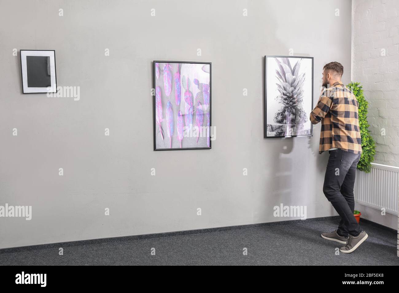 Man at exhibition in modern art gallery Stock Photo - Alamy